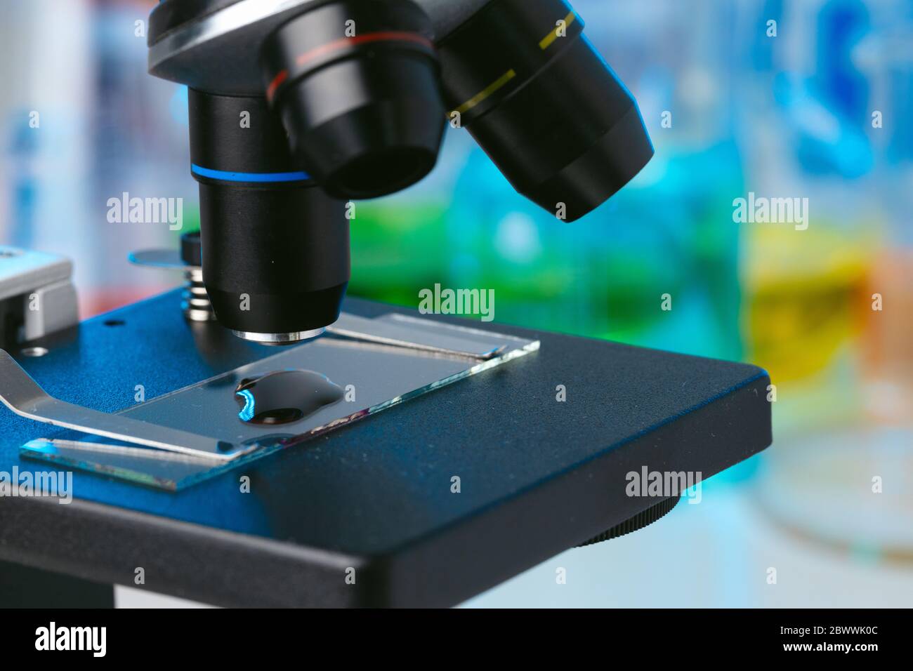 Scientific laboratory with microscope and test tubes with samples ...