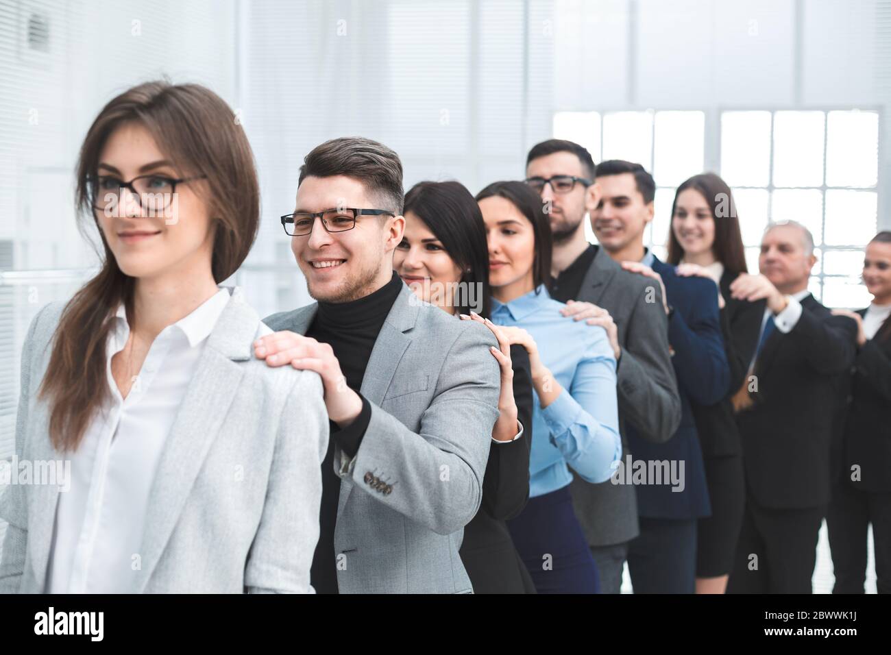 group of young business people standing behind each other Stock Photo ...