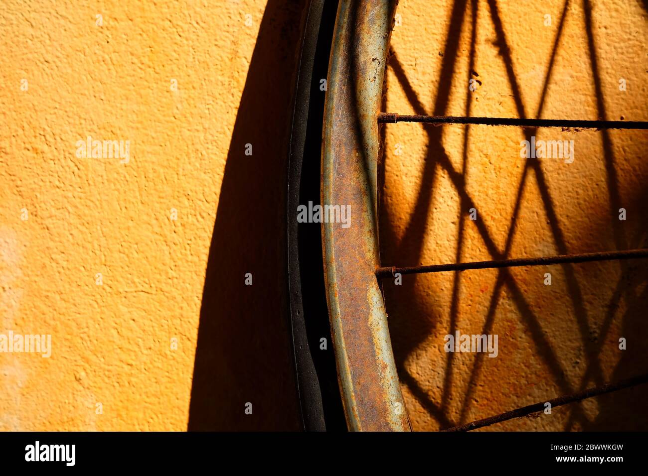 Old Bicycle Wheel with Shadow Stock Photo - Alamy