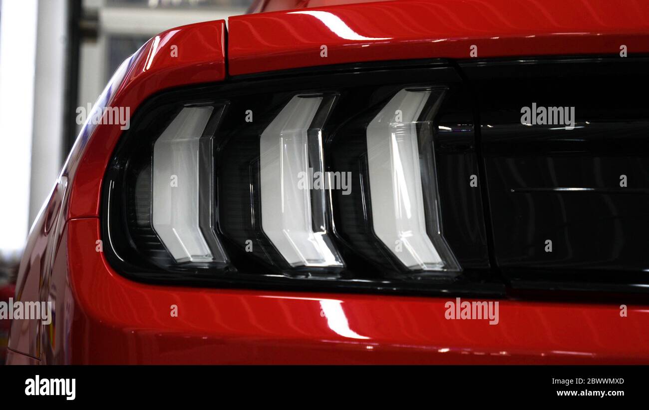 Close up to PPF installation process on a front headlight and hood. PPF ...