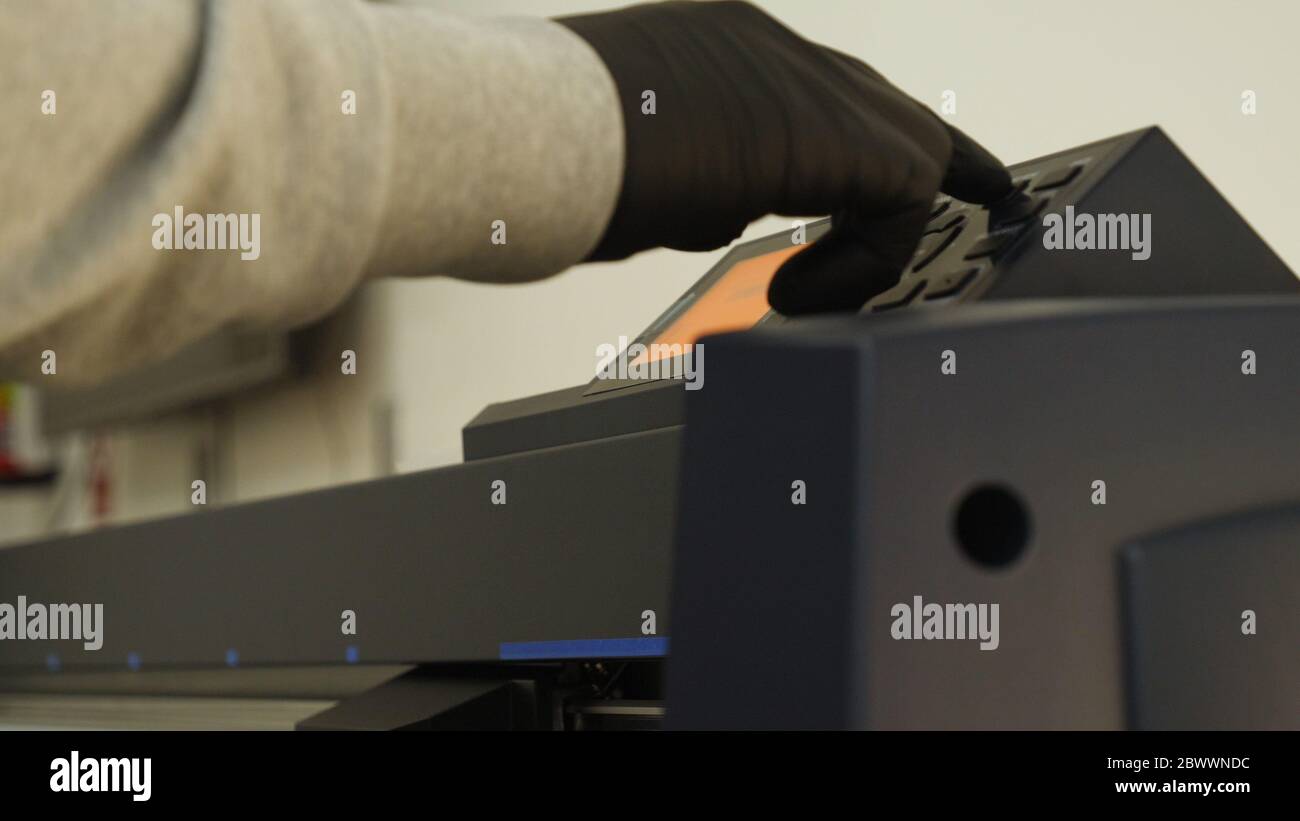 Industrial worker input data programing for CNC milling machine Stock Photo - Alamy