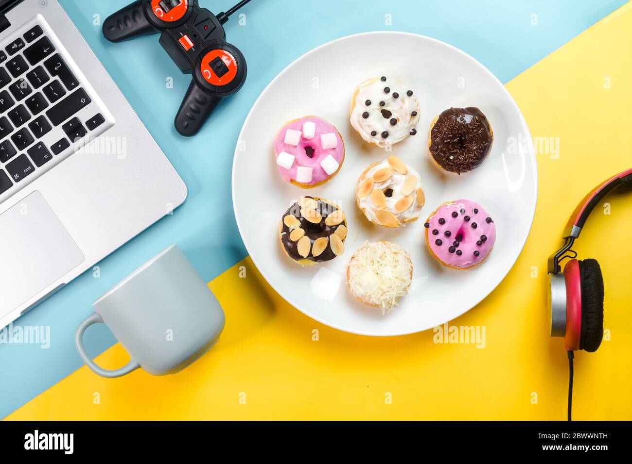 Colourful doughnuts combined with laptops and items in the office Stock ...