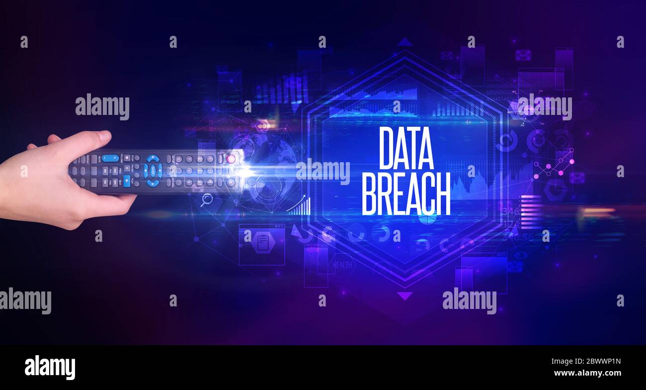 hand holding wireless peripheral with DATA BREACH inscription, cyber ...