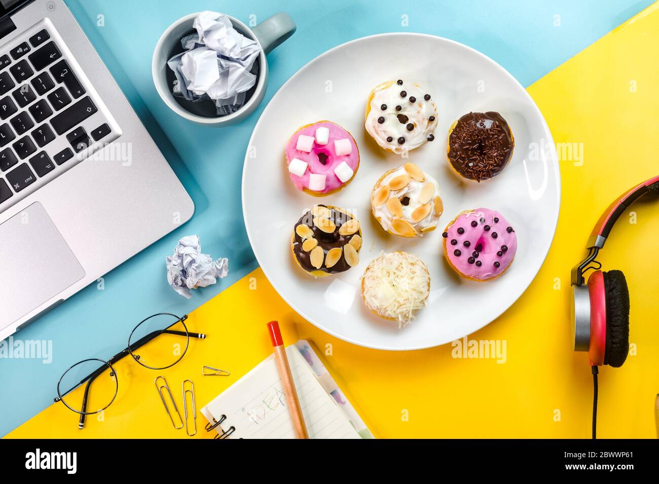 Colourful doughnuts combined with laptops and items in the office Stock ...