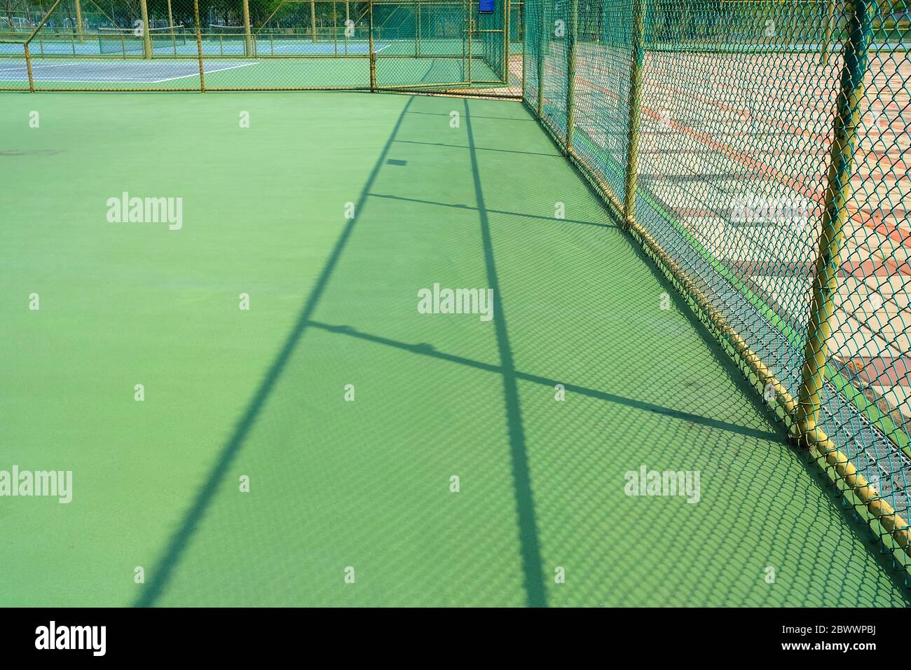 Shadow Fence in Tennis Court Stock Photo - Alamy