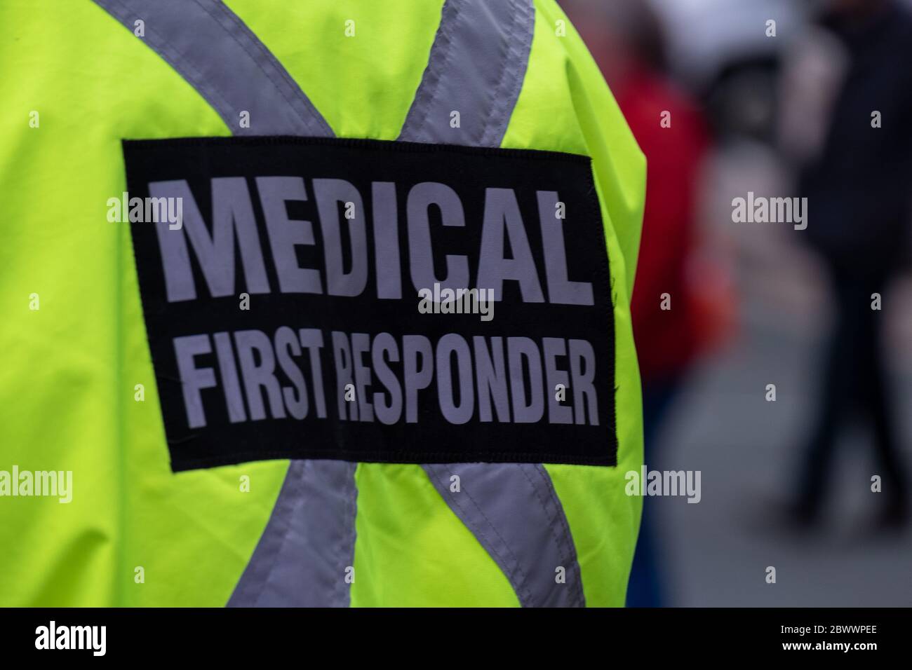 A bright yellow medical first responder uniform being worn by a large ...