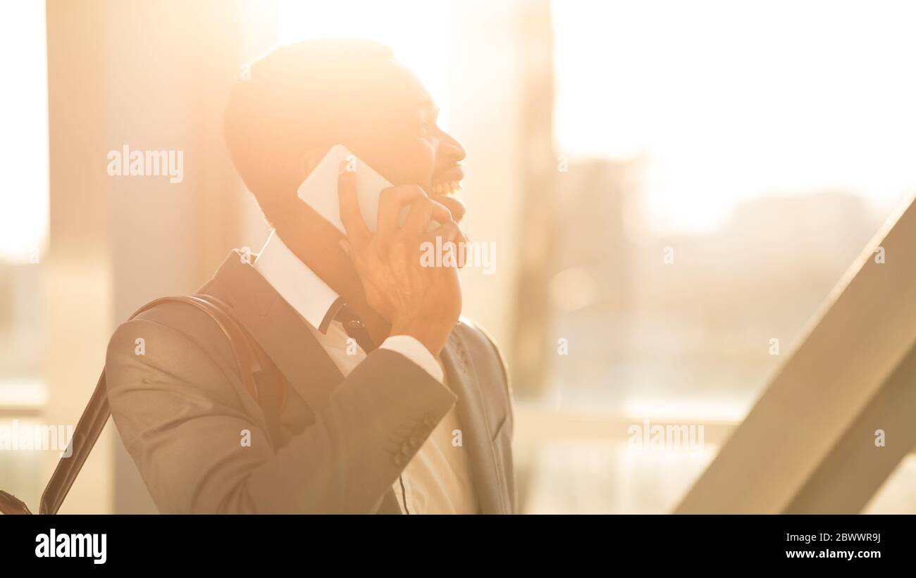 Businessman talking on phone walking hi-res stock photography and ...