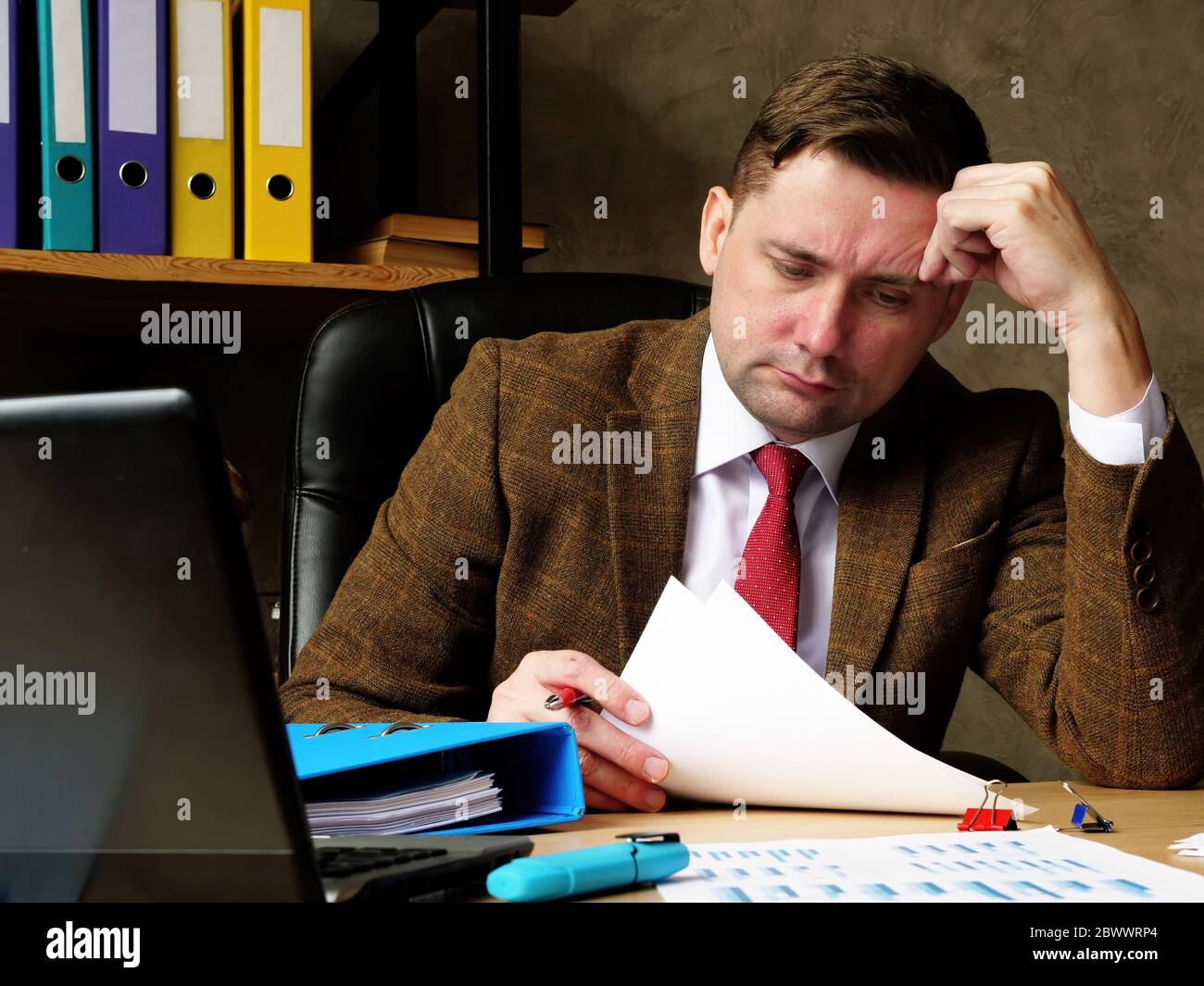 Overworked man pile of papers hi-res stock photography and images - Alamy