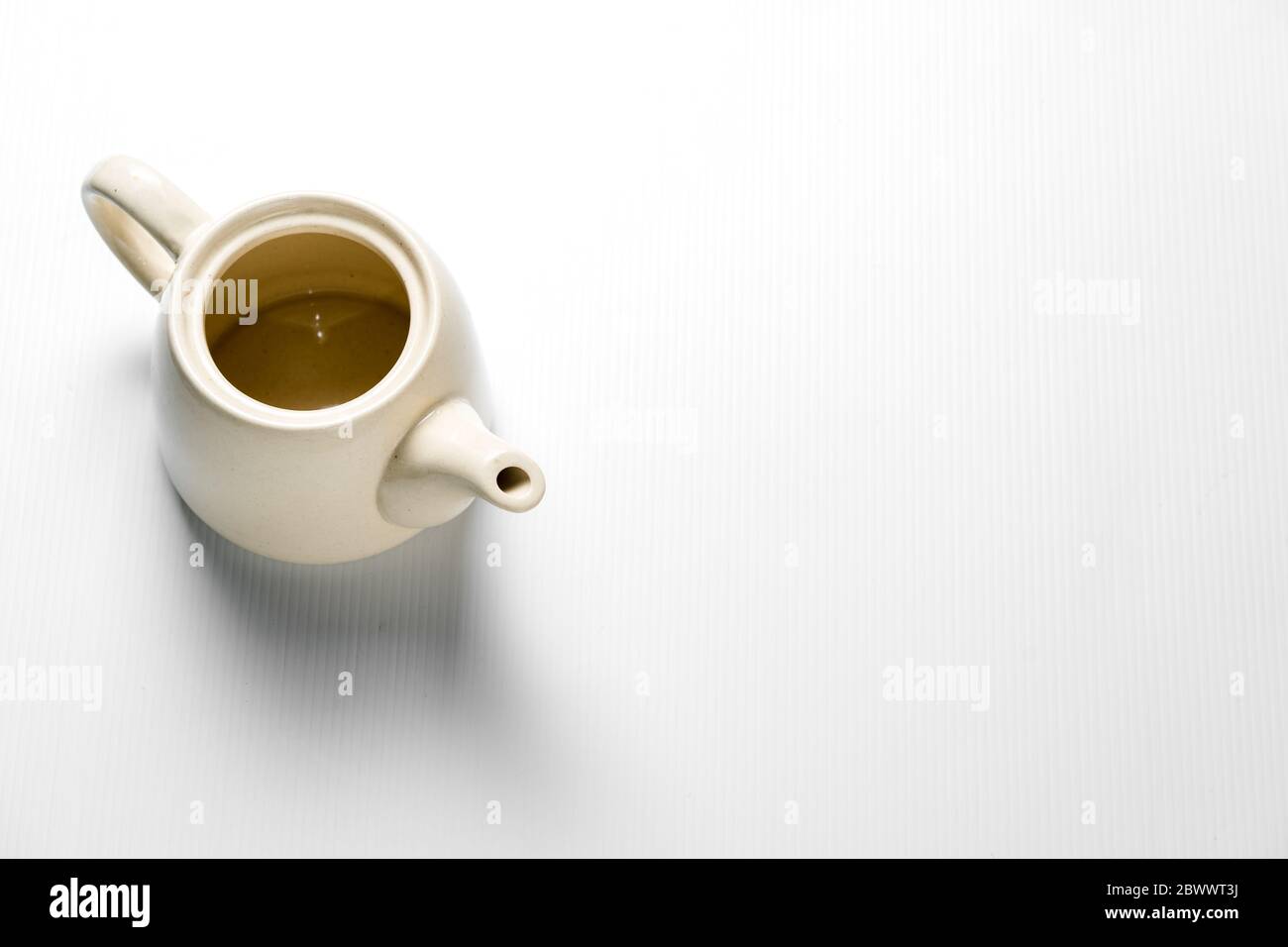 An empty tea pot isolated on white background Stock Photo - Alamy