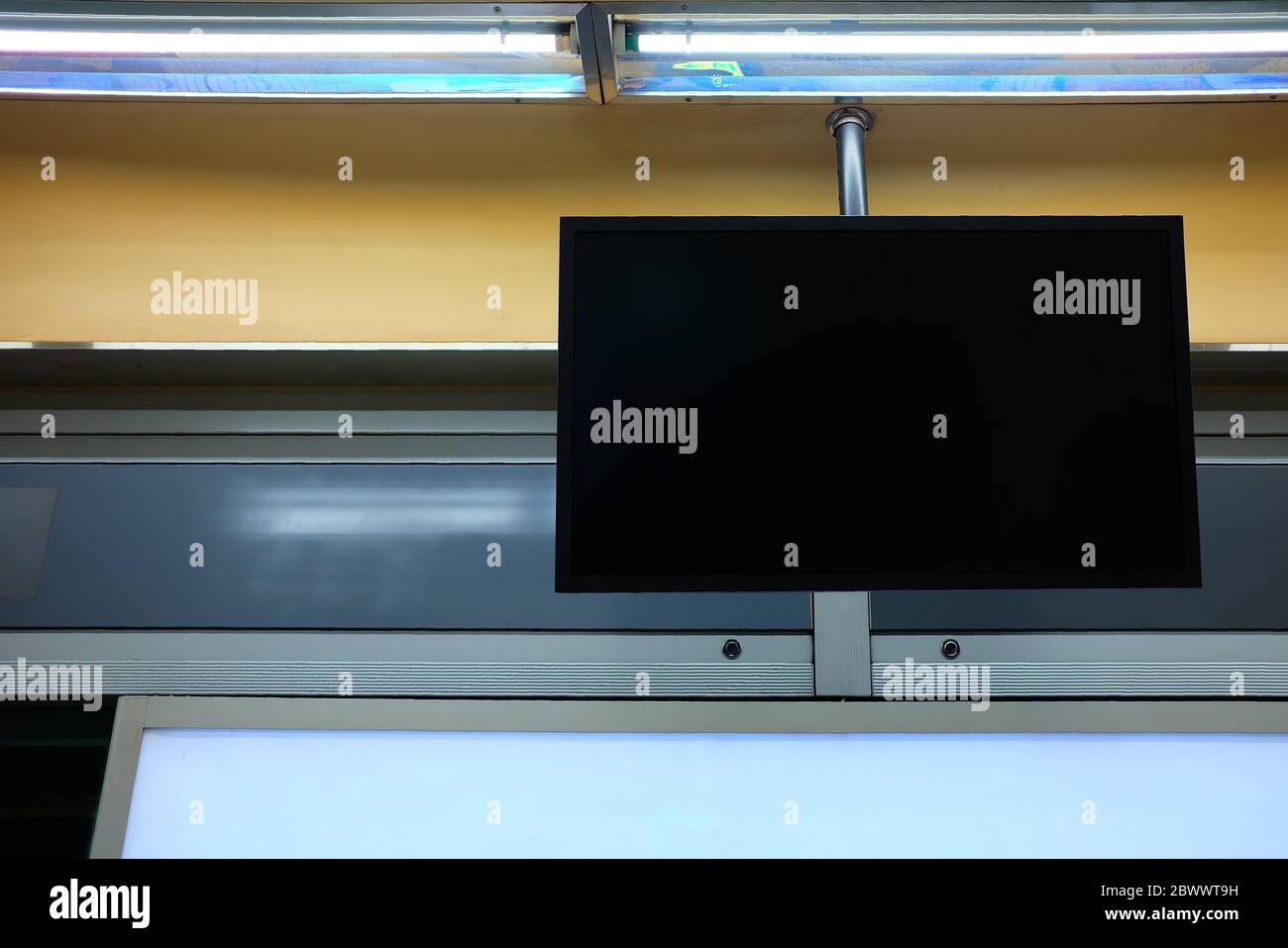 LED Screen Monitor Hanging at the Subway Stock Photo - Alamy