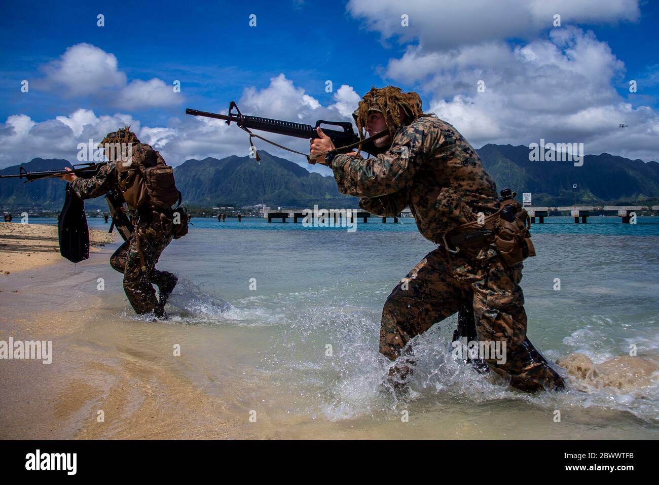U.S. Marines with with Lima Company, 3rd Battalion, come ashore during ...