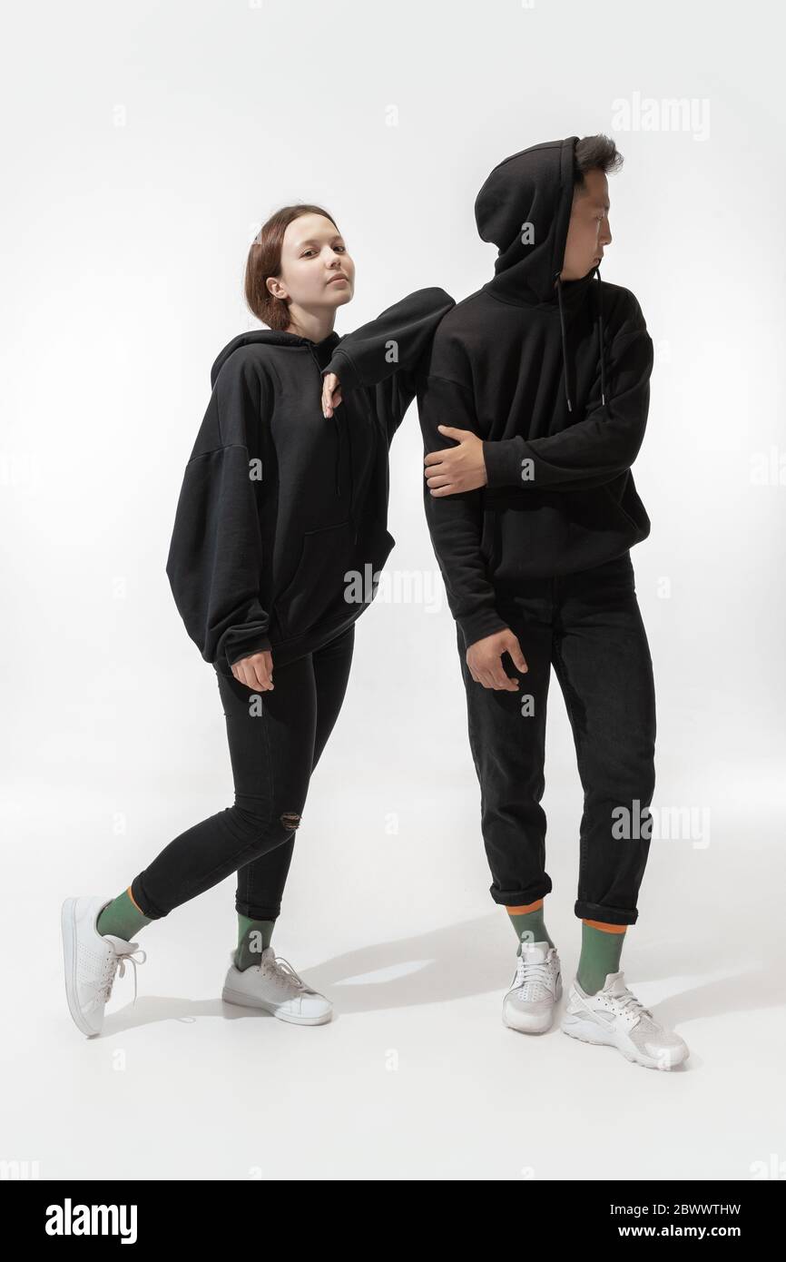 Friend. Trendy fashionable couple isolated on white studio background ...