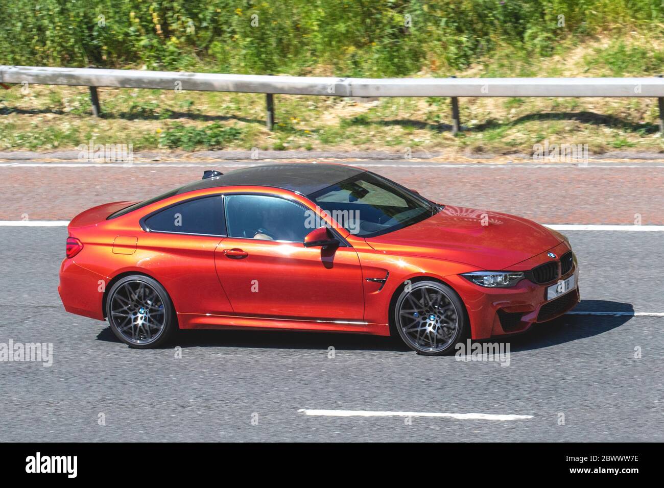 2019 orange BMW M4 Competition Package S-; Vehicular traffic moving ...