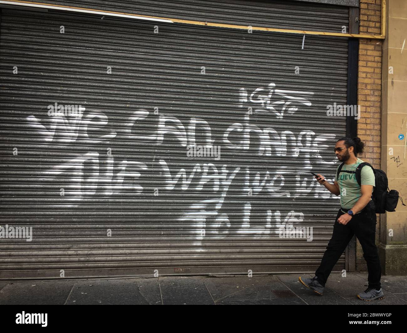 Glasgow, UK, 3rd June 2020. Graffiti reading "We can change the way we ...