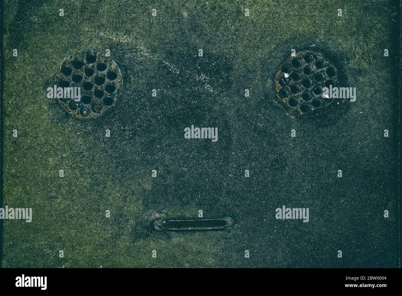 Close up Drainage Cover in Robot Face Stock Photo - Alamy
