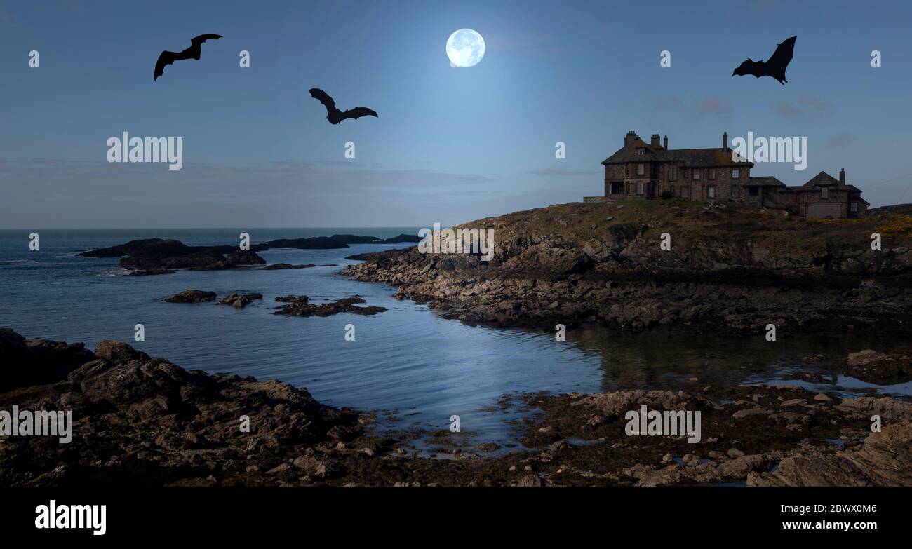Surreal Halloween scene of a Gothic mansion on a rocky coast with a ...