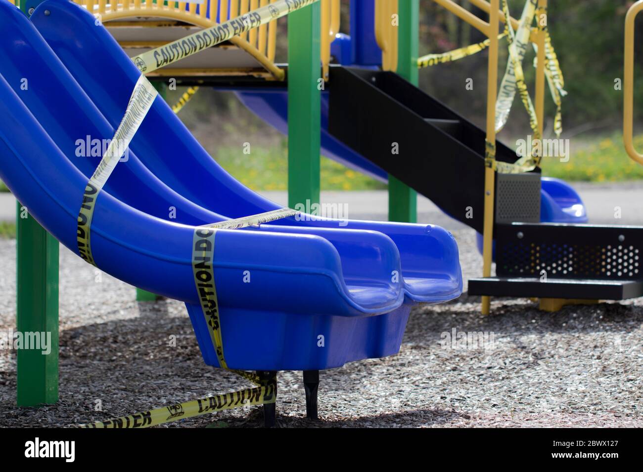 Slides at closed park shut down Coivd-19. Children's playground with ...