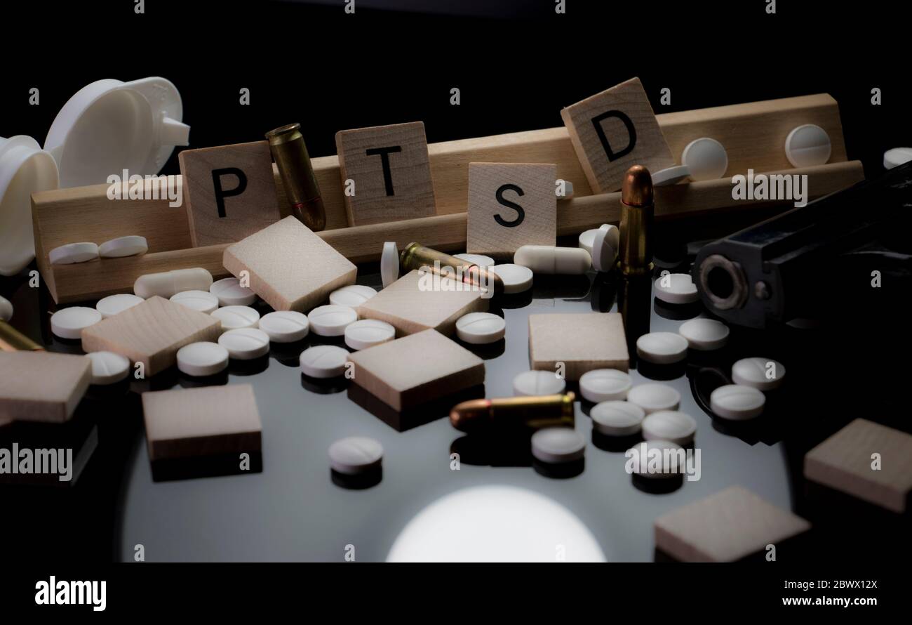 PTSD in text with pills, bullets and hand gun. Concept of Post ...