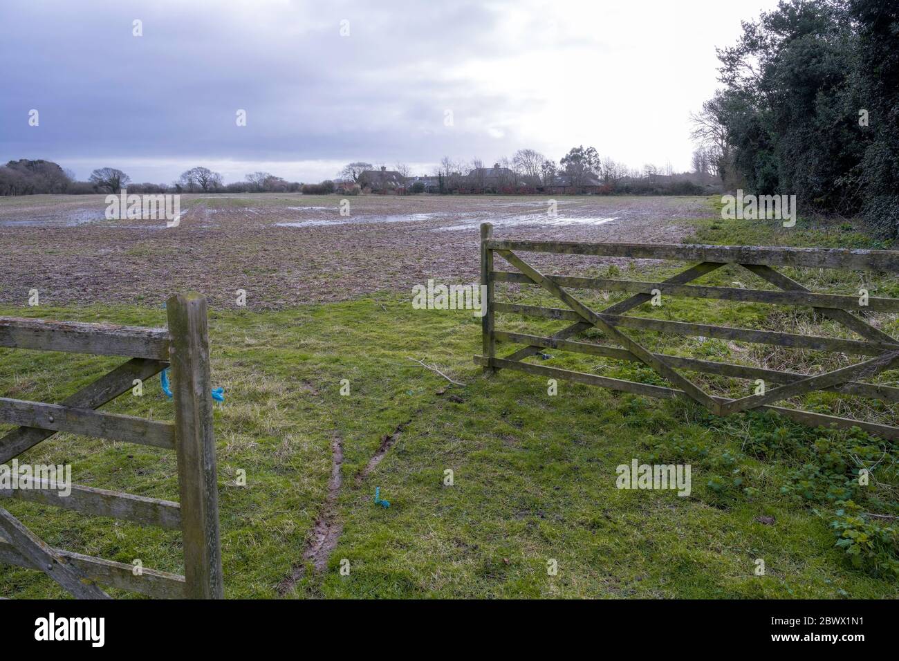 Gate open in countryside Stock Photo - Alamy