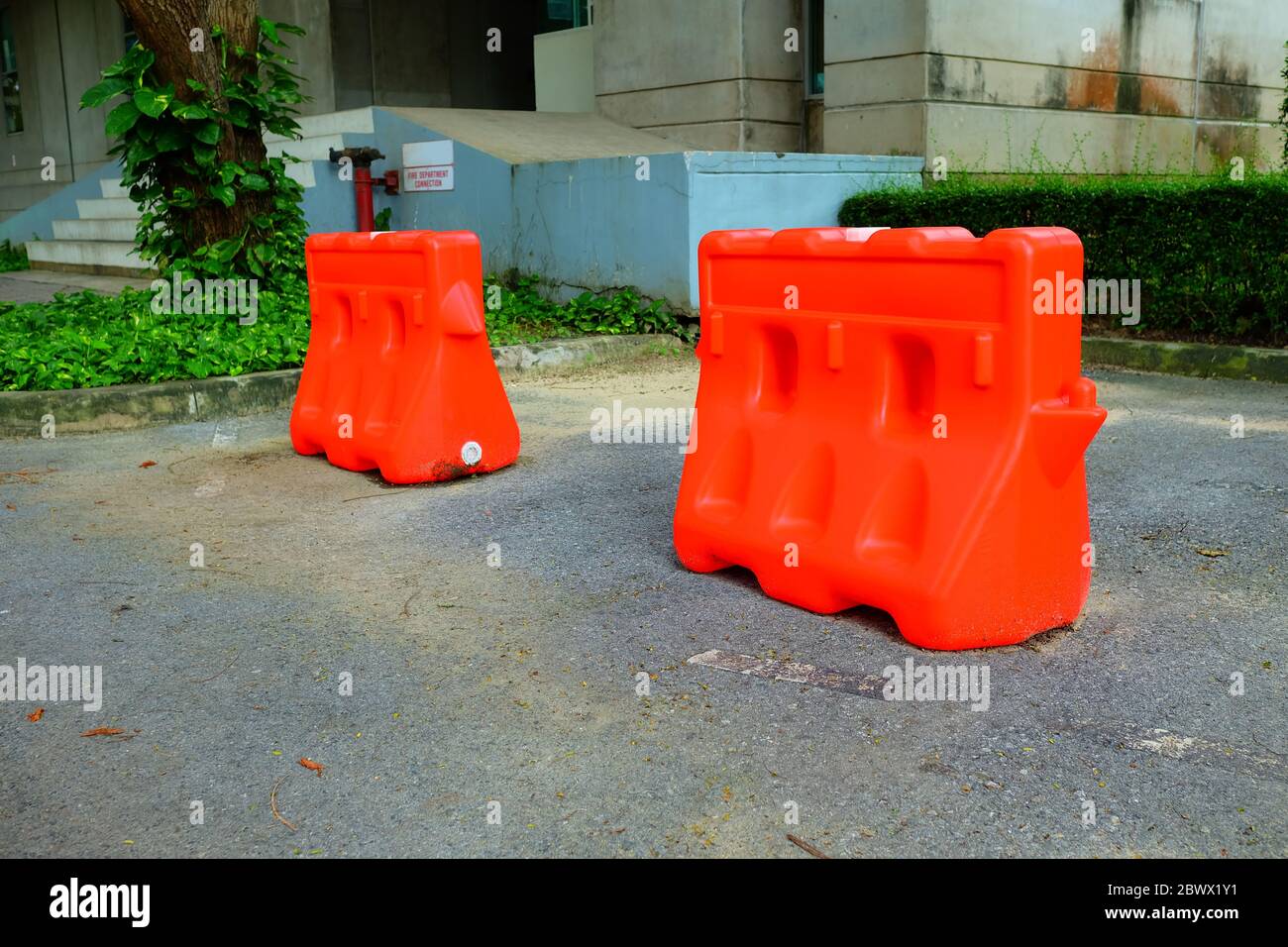 Red Plastic Barriers Standing on the Road Stock Photo - Alamy