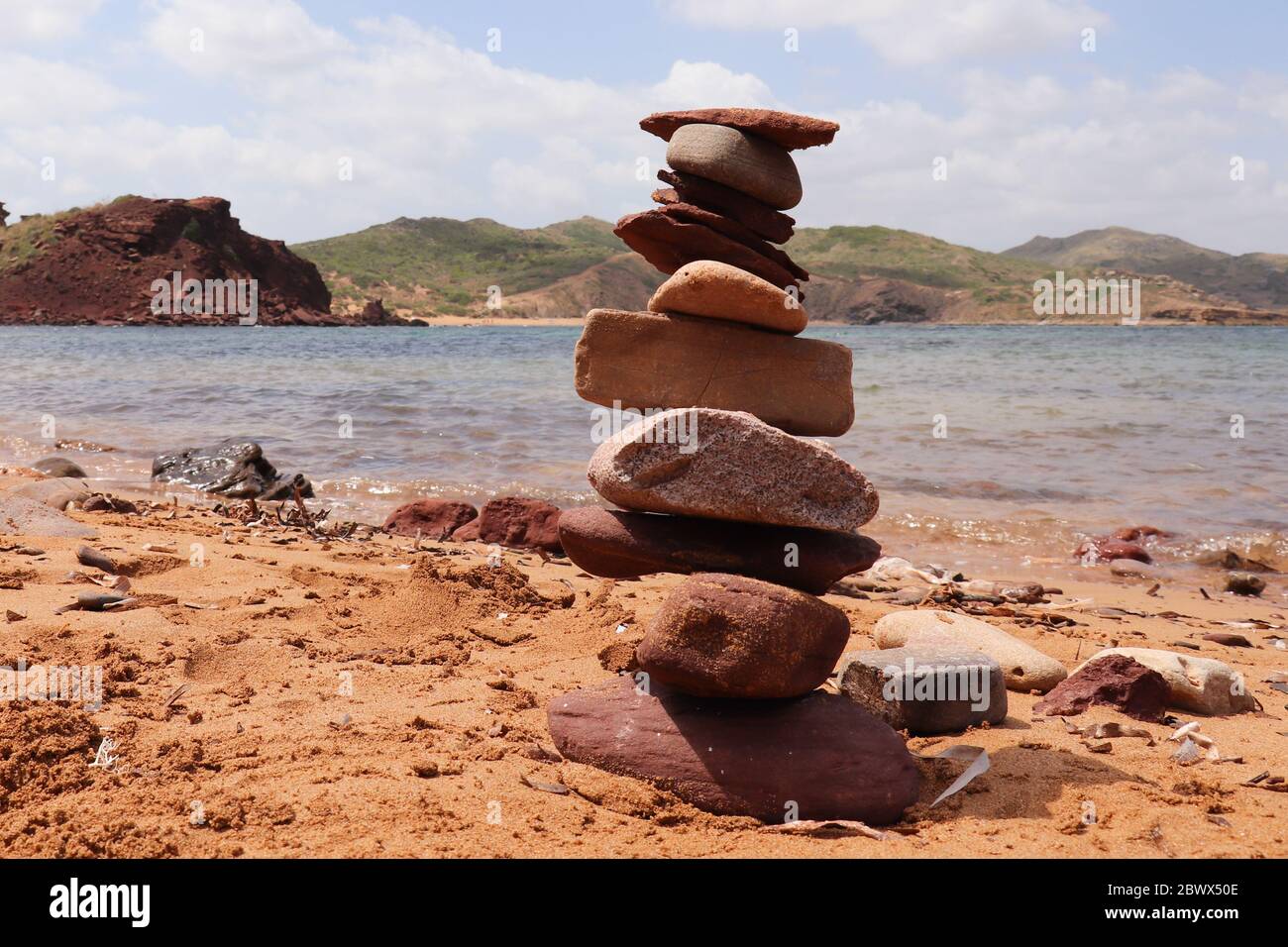 Balance with stones in the middle of the beach Stock Photo - Alamy