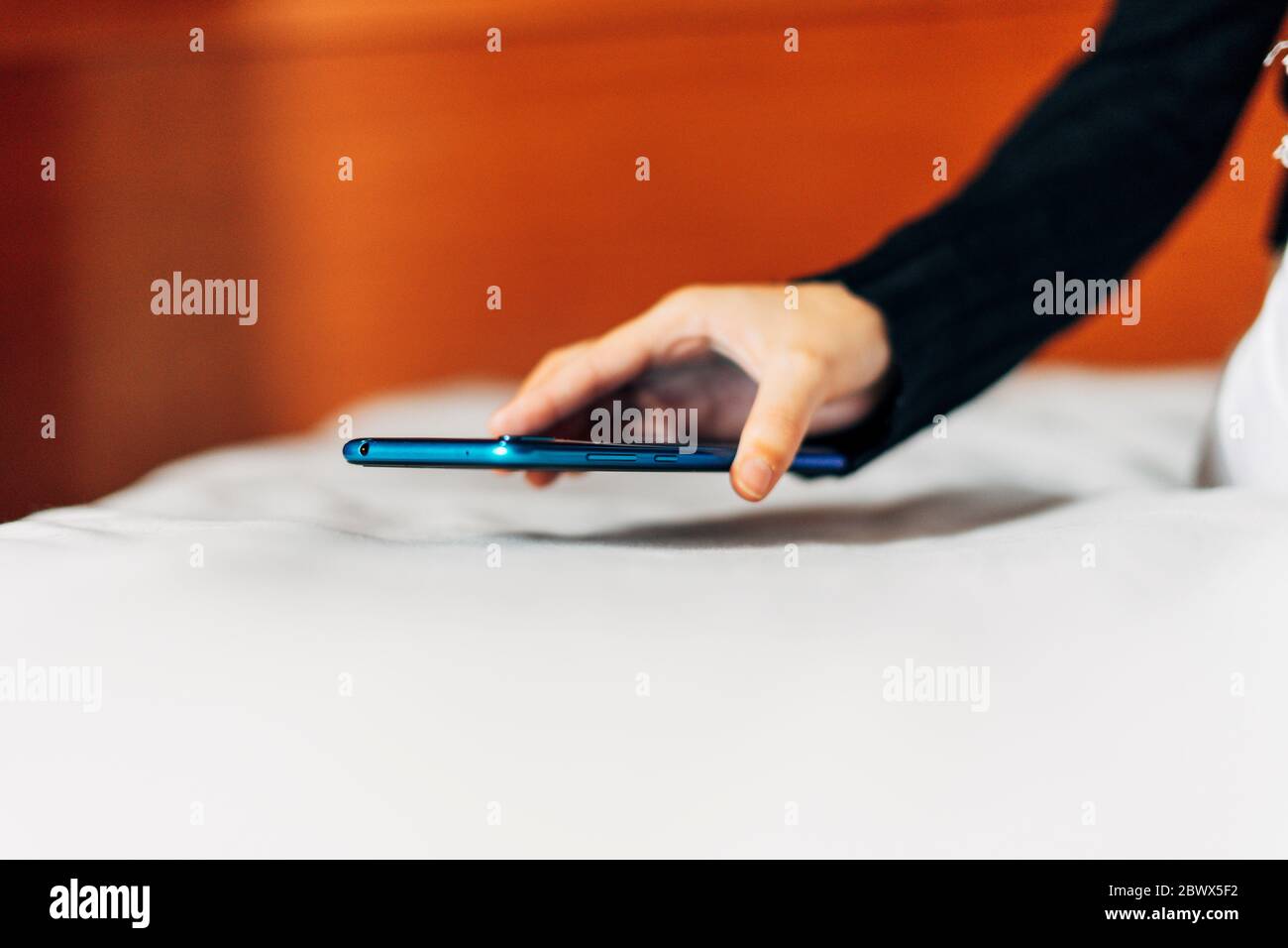 Hand leaving mobile phone. At home without technology Stock Photo - Alamy