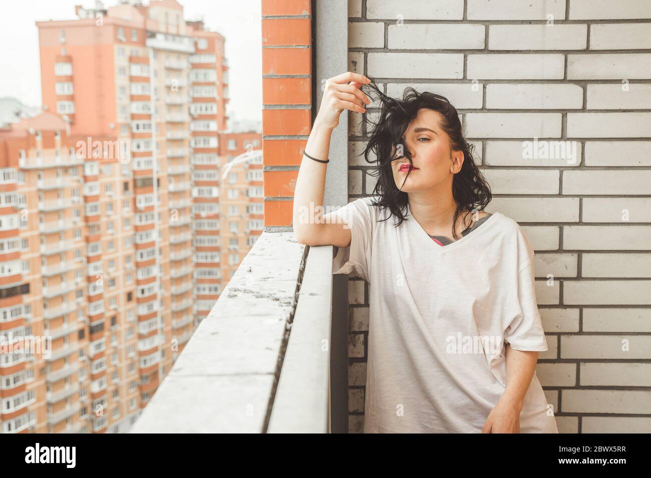 Girl at her house balcony with her doll during lockdown period due to ...