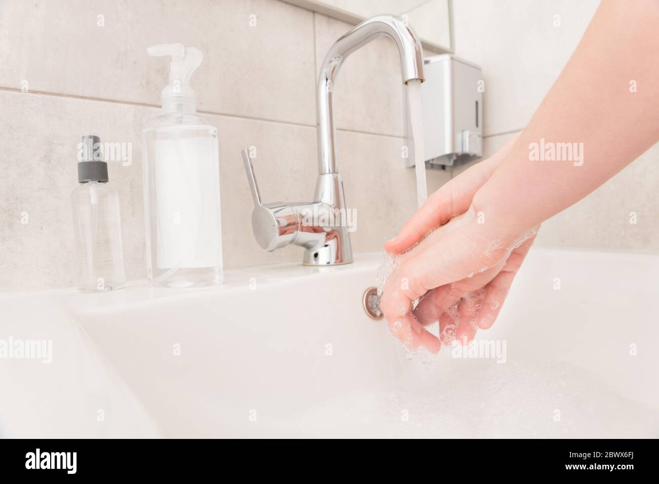 Closeup cropped photo lady wash arms sink stream hot water flow rub ...