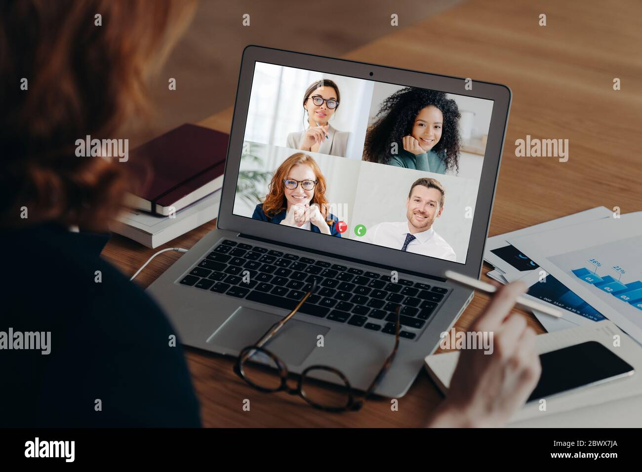 Businesswoman uses laptop application for communication with several ...