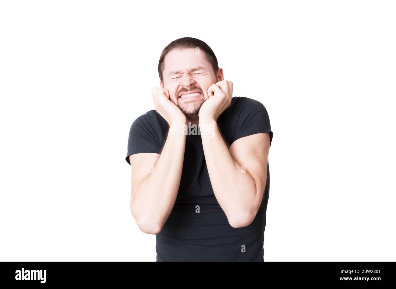 Young man with emotional facial expression, stressed or angry. Isolated ...