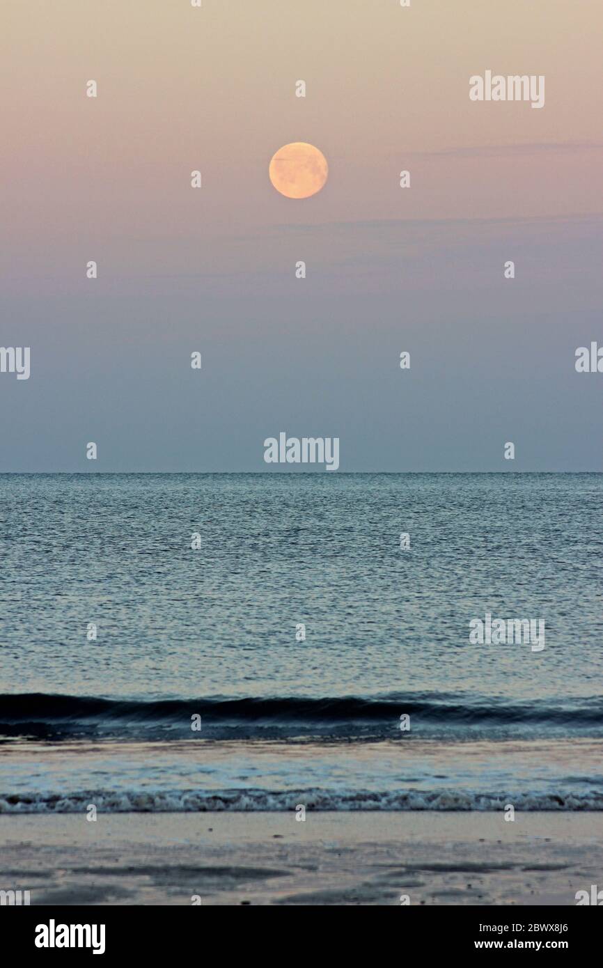 Dawn view full moon setting hi-res stock photography and images - Alamy