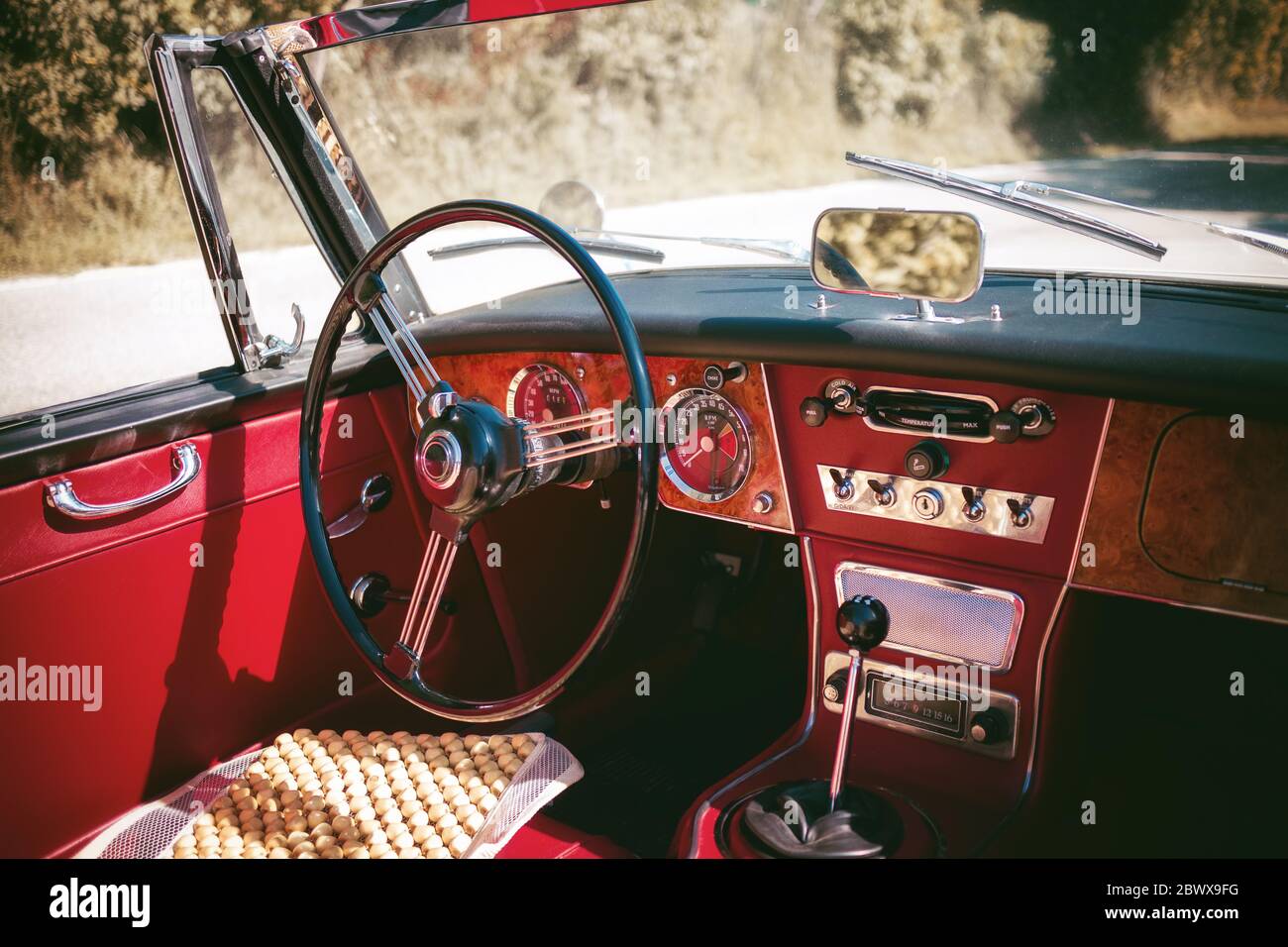 Cockpit of an old red vintage cabriolet sport car Stock Photo - Alamy