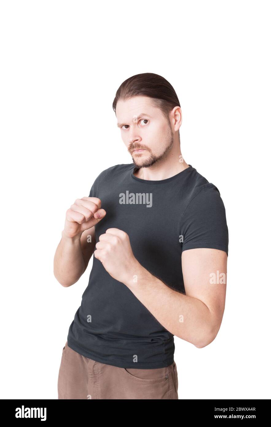 A young man in a protective pose with defense. Isolated on a white ...