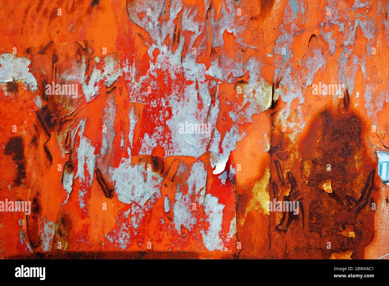 Torn Poster on Red Rusty Metal Wall Texture Background Stock Photo - Alamy