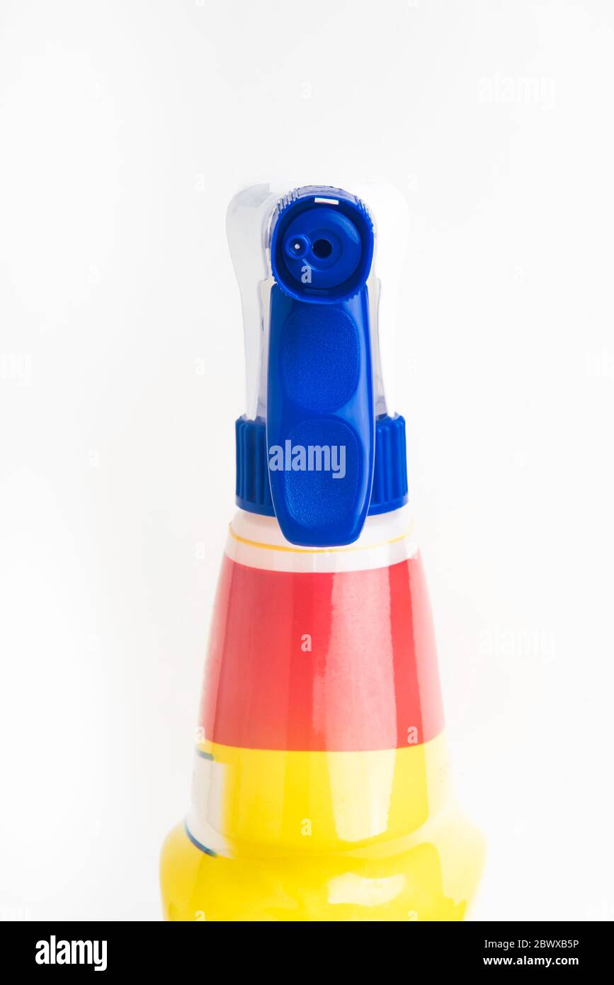 A close-up of the top portion of a red, white, and blue liquid spray ...