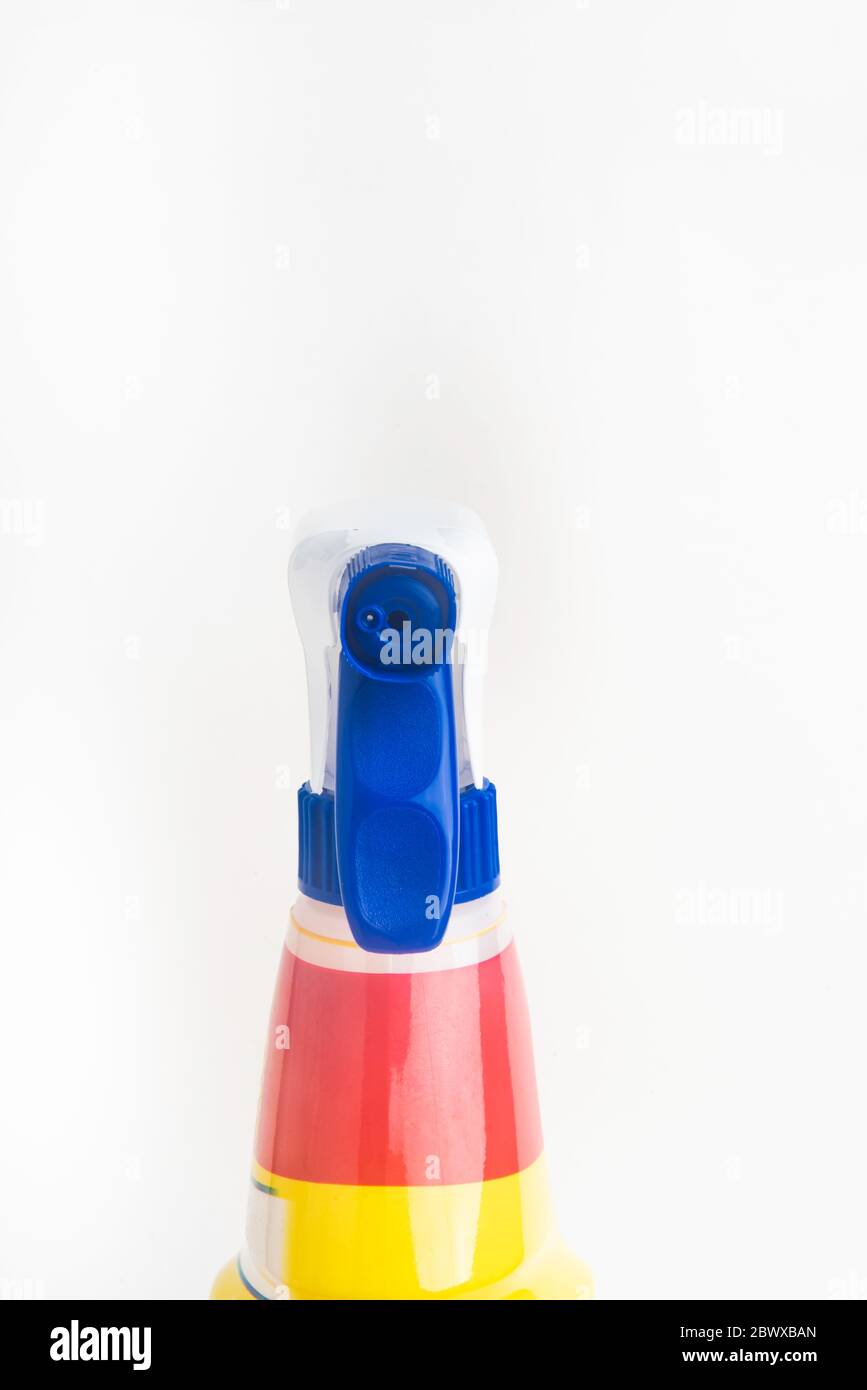 A close-up of the top portion of a red, white, and blue liquid spray ...