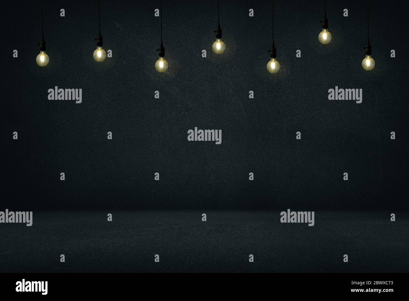 Light Bulbs in the Dark Concrete Room Texture Background Stock Photo ...