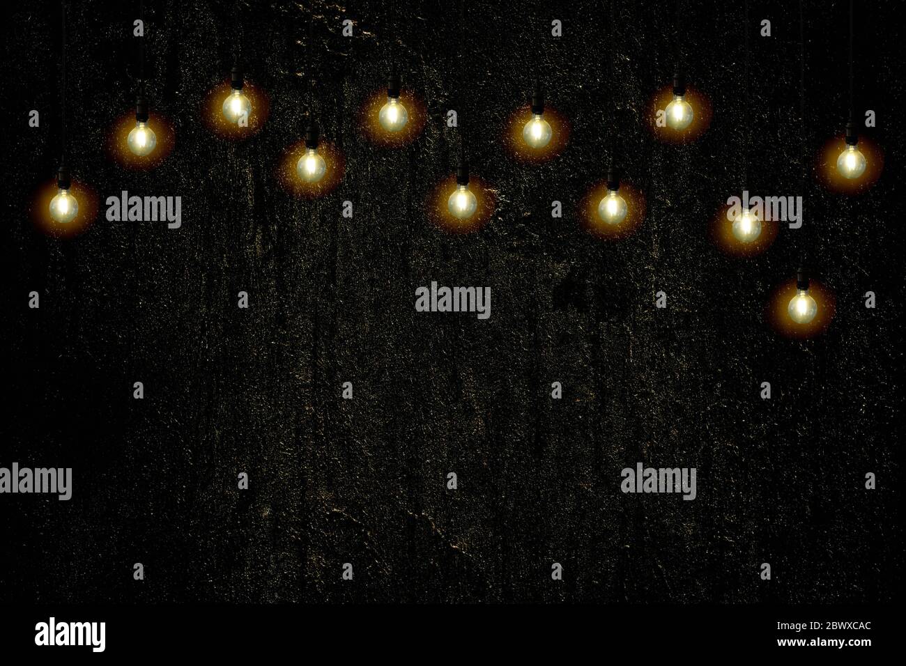 Light Bulbs in the Dark Concrete Wall Texture Background Stock Photo ...