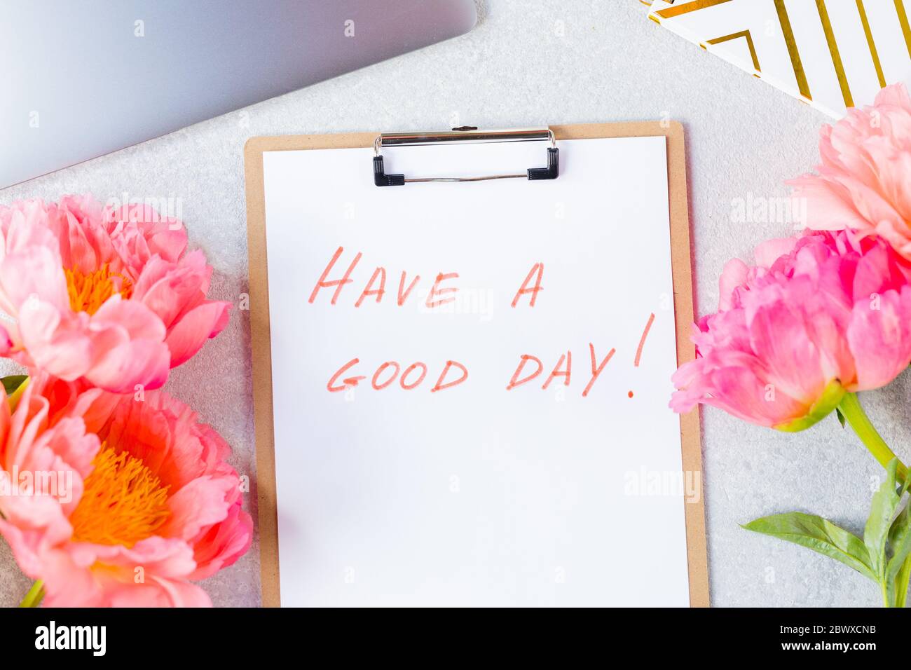 Desk top view. Phrase words Have A Good Day. Peonies top view, flat lay ...