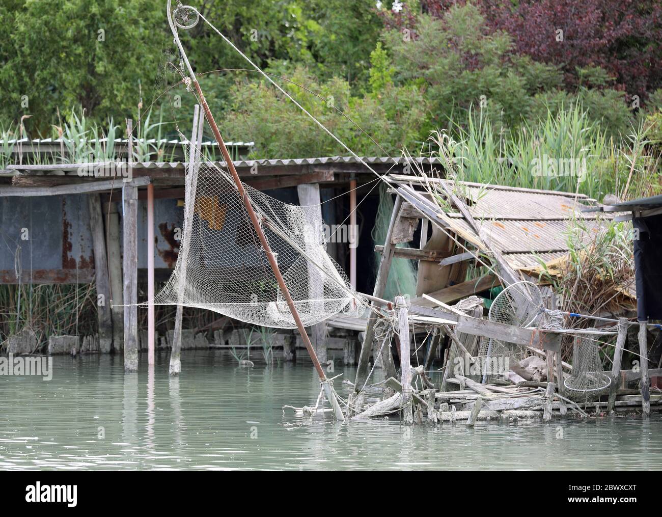 old abandoned large fishing net on the bank of the fishing village ...