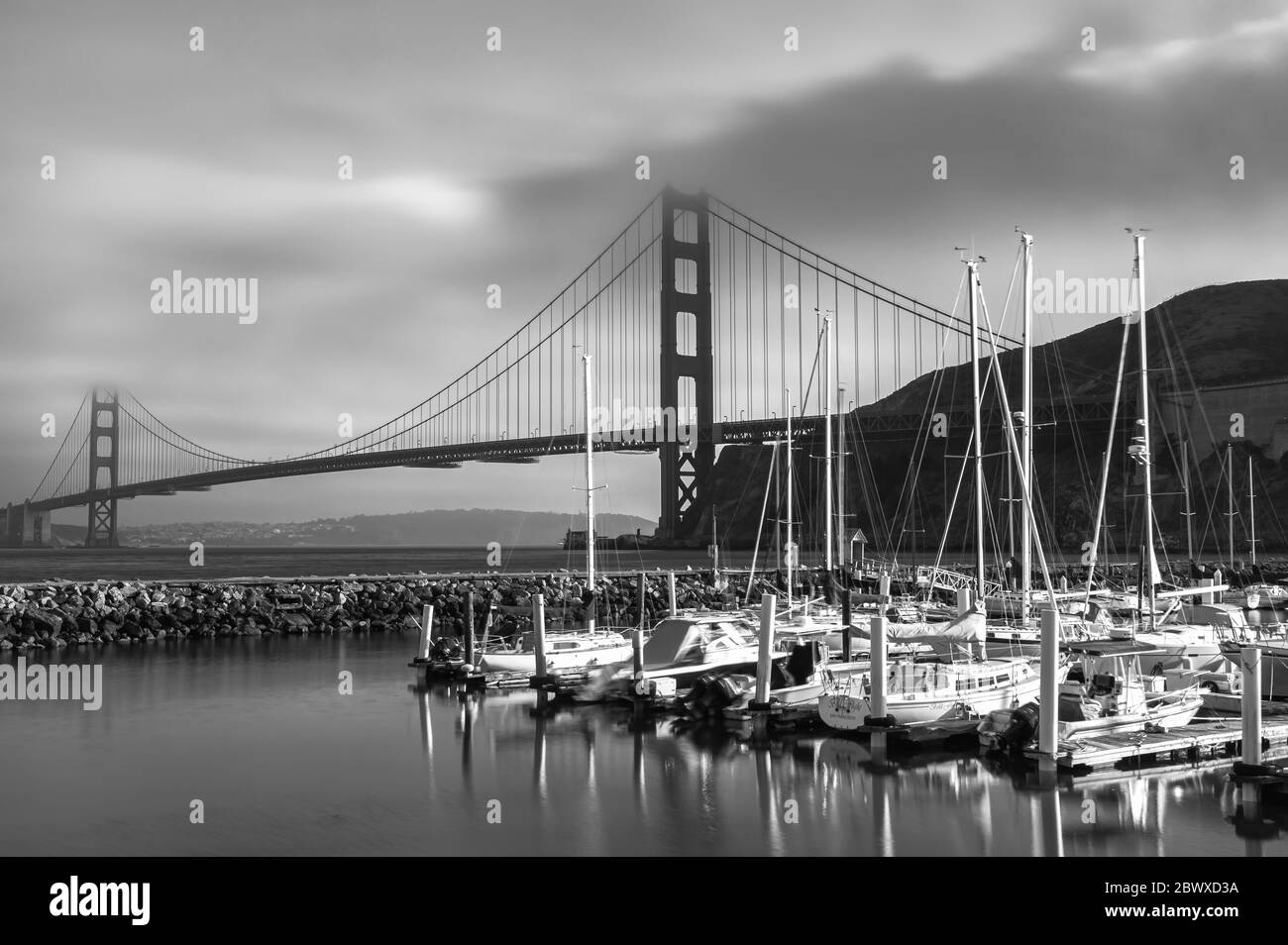 The Golden Gate Bridge at early evening as fog approaching the bay ...