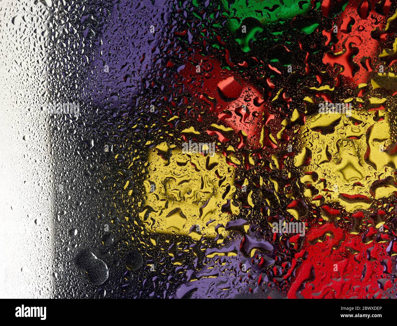 Water droplet patterns on hard surface with colourful background Stock ...