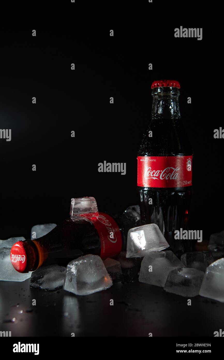 Lviv, Ukraine - May 21, 2020: two glass bottle of coca cola at black ...