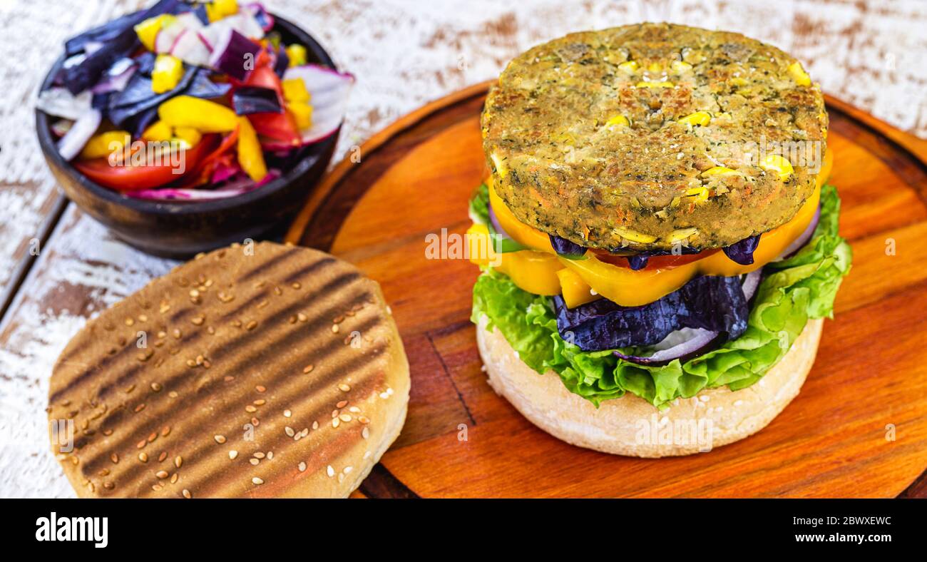 Vegan hamburger, Sandwich made without meat, with glass of green juice ...
