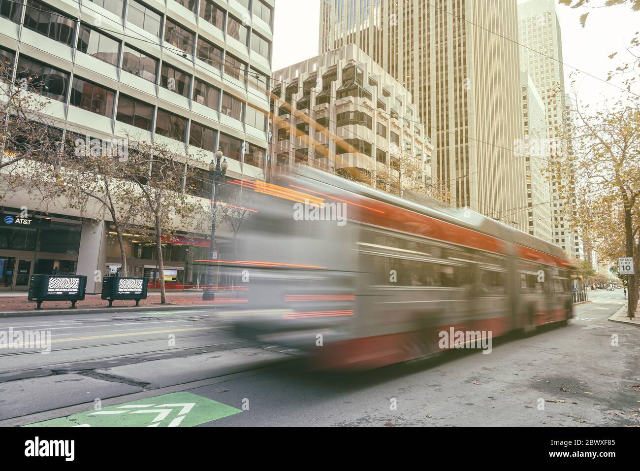 Long exposure of a moving trolley bus at Market Street in San Francisco ...