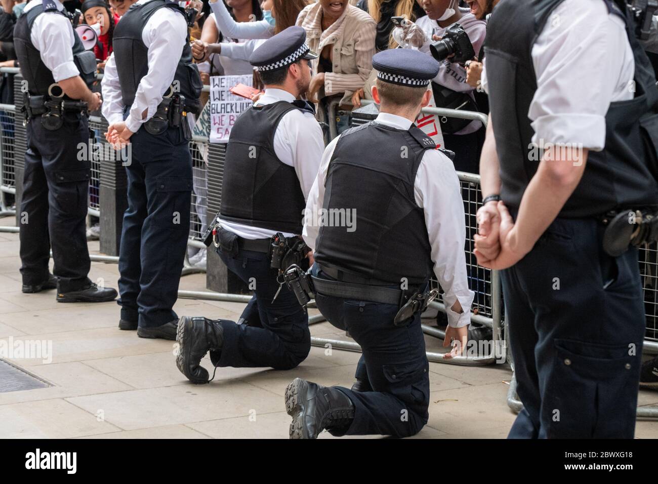 London, UK. 3rd June, 2020. British police officers "take the knee ...