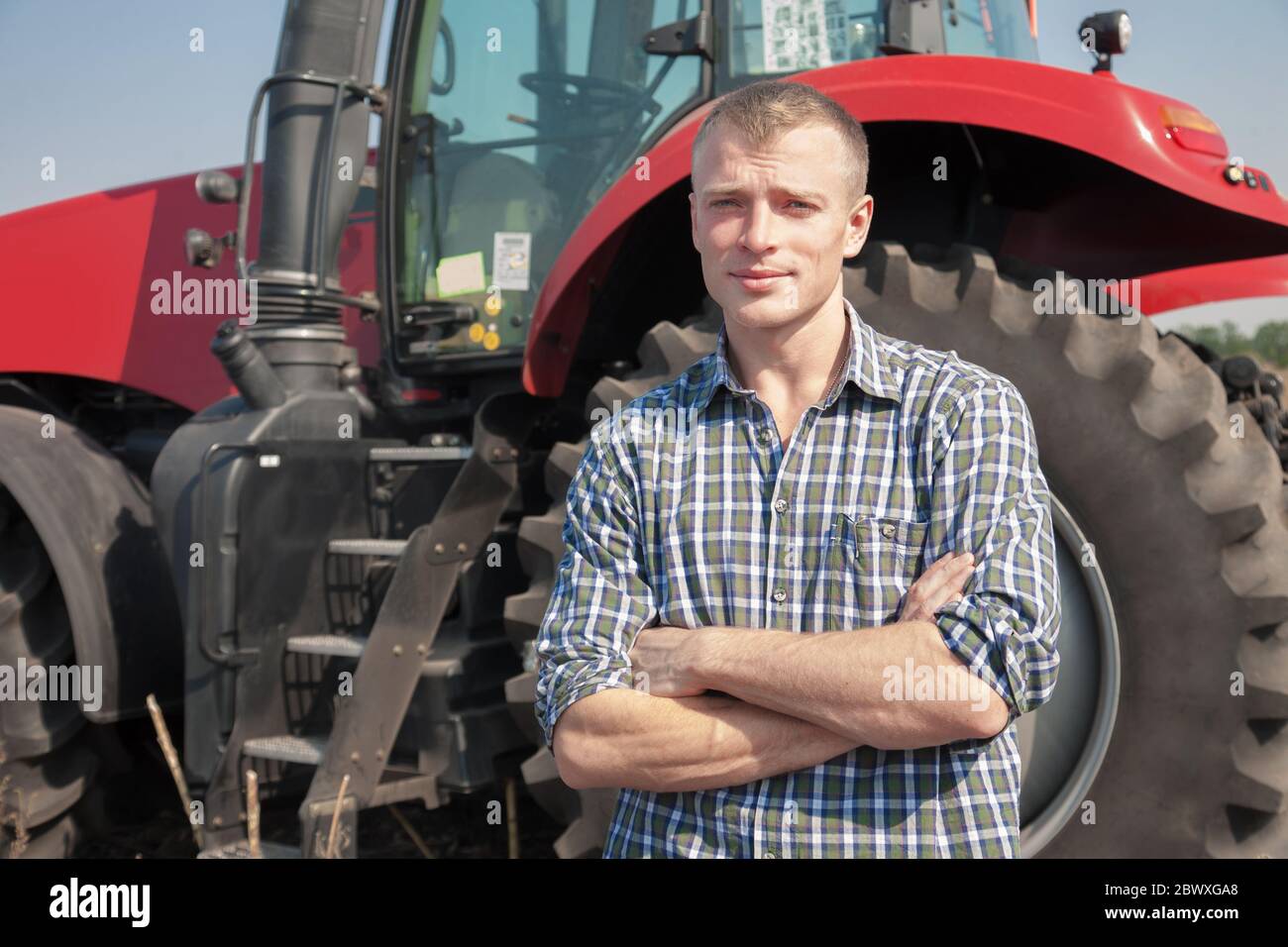 Farmer posing with tractor hi-res stock photography and images - Alamy