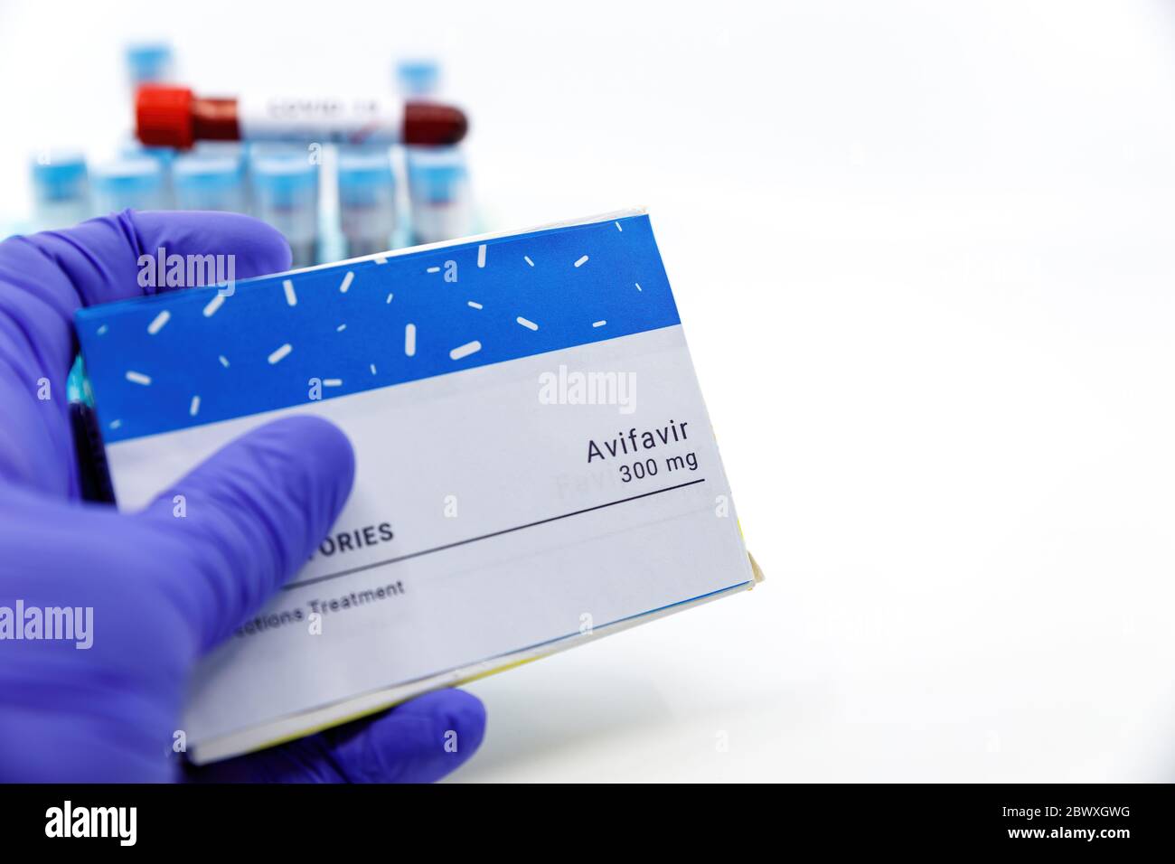 Dubai-UAE-Circa 2020:Doctor showing box of medicine for covid-19 ...