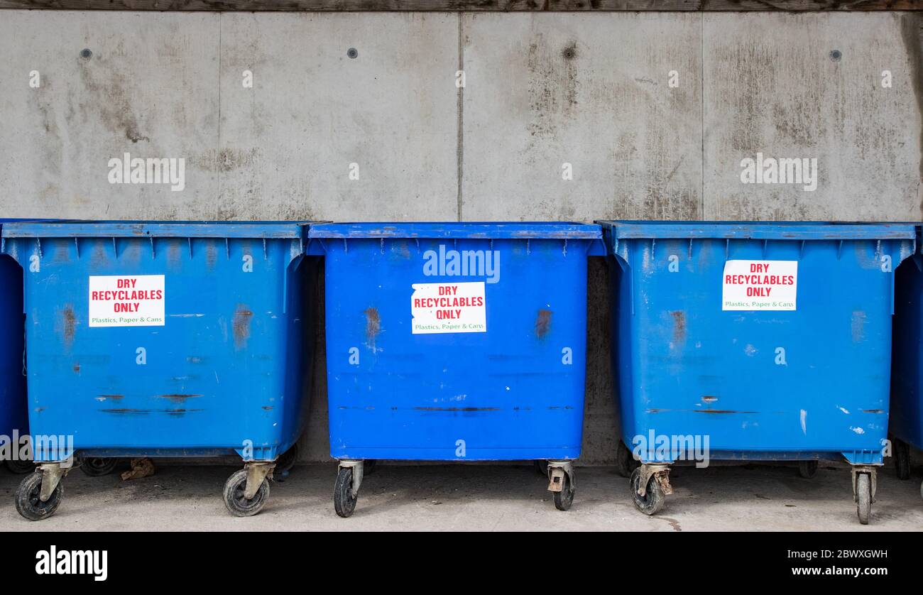 Big blue recycling containers for recycling plastics, paper and cans ...