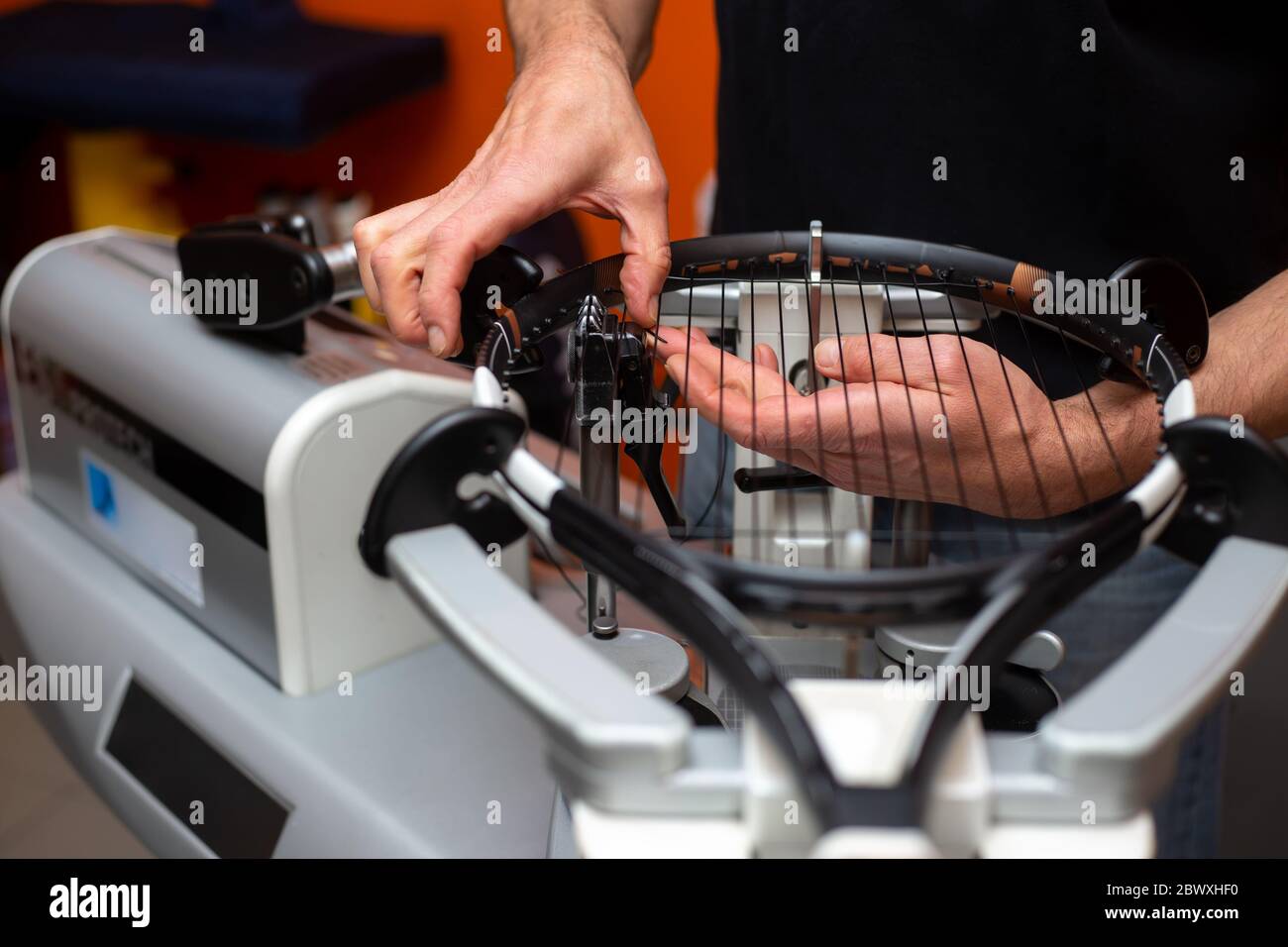 Process of stringing a tennis racket in a tennis shop, sport and ...
